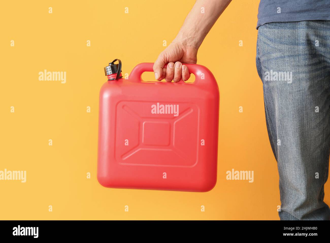 Man holding gas can hi-res stock photography and images - Alamy