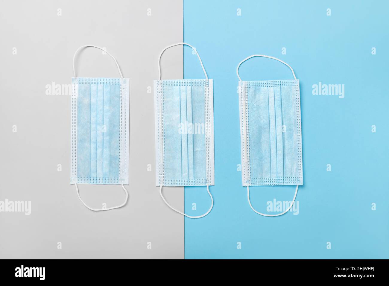 Surgical masks on color background Stock Photo - Alamy