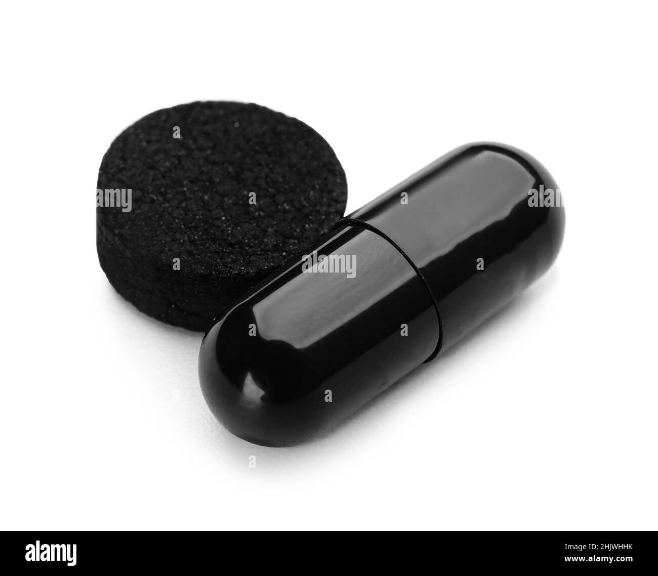Activated carbon in capsule and pill on white background Stock Photo ...