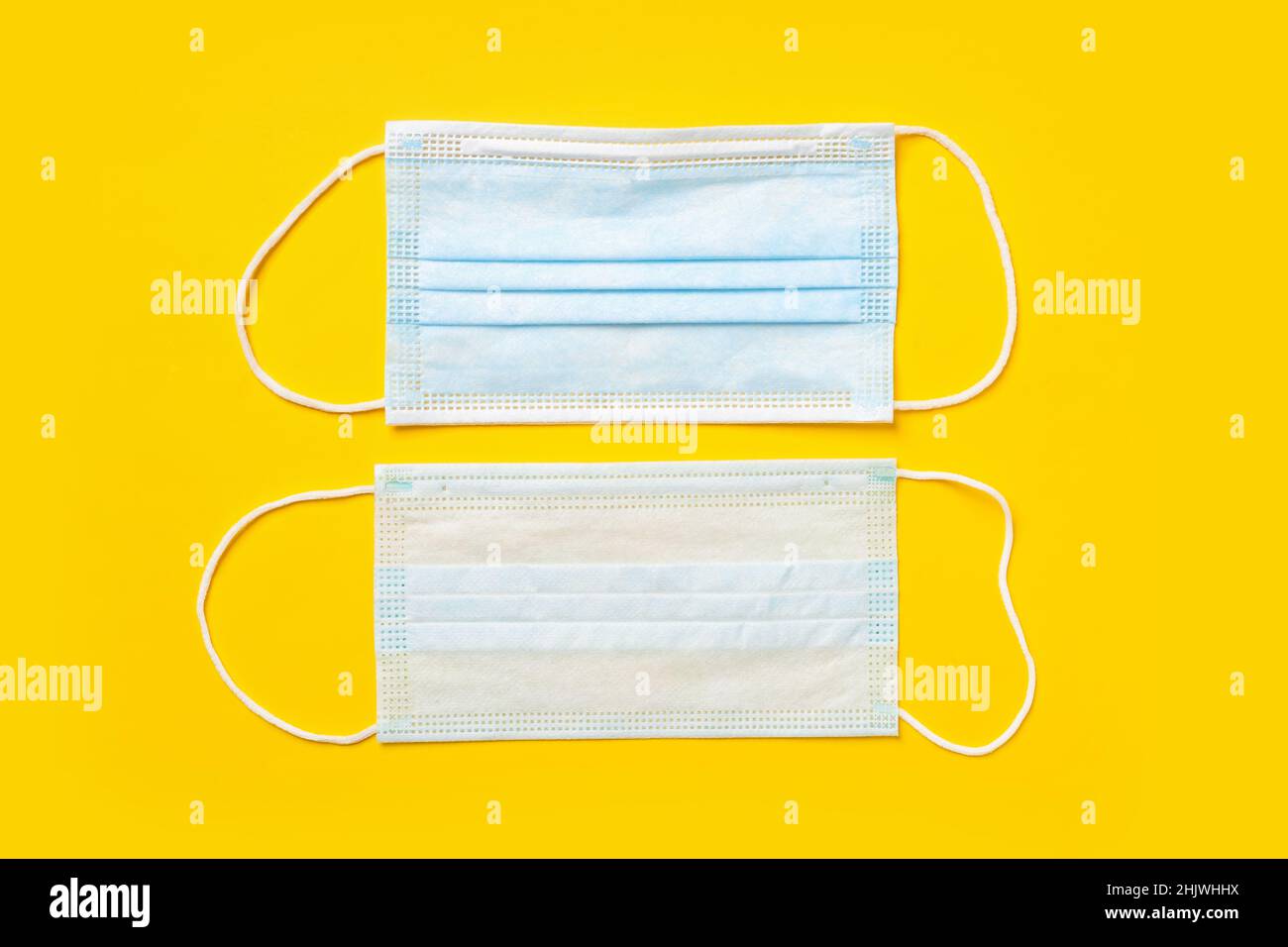 Surgical masks on color background Stock Photo - Alamy