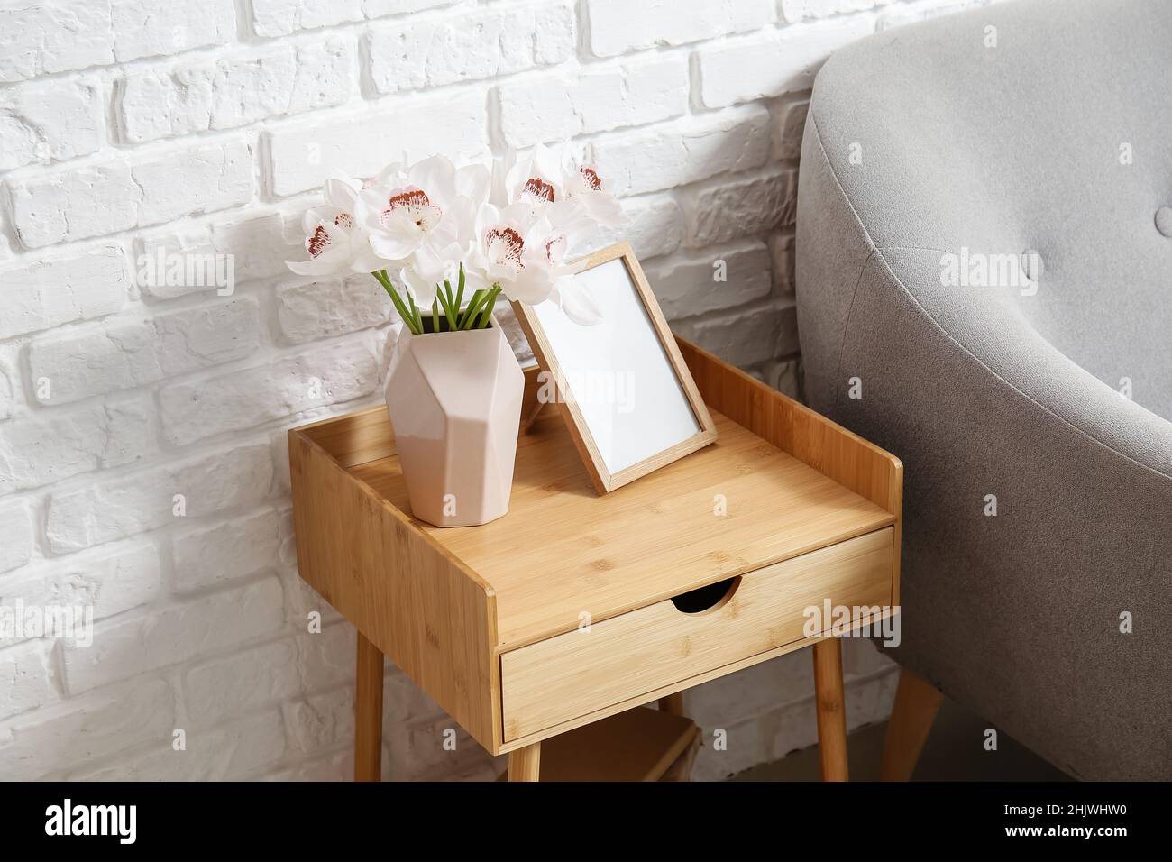 Modern interior of room with table and armchair Stock Photo - Alamy