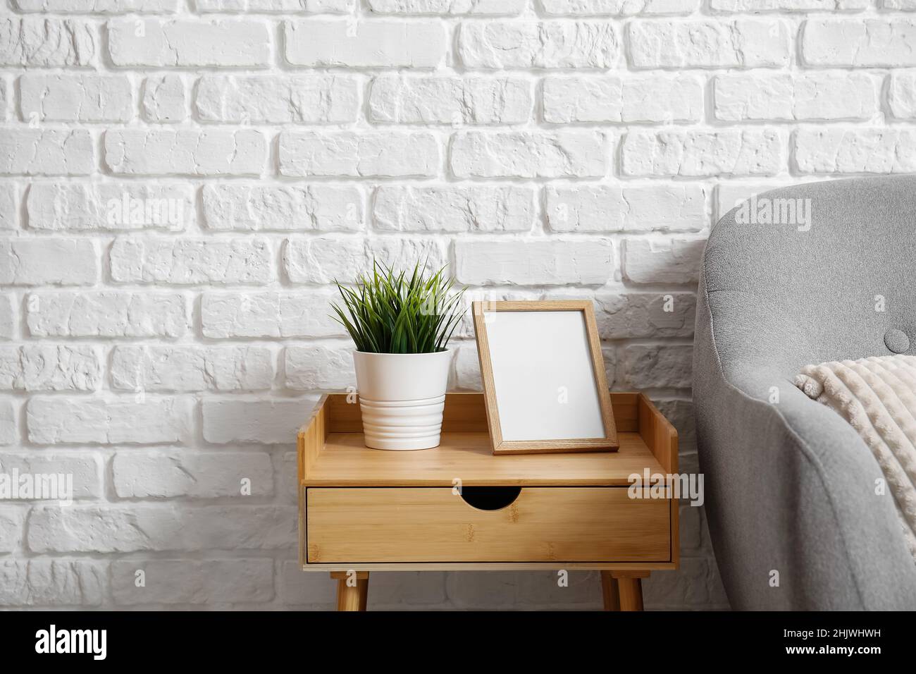 Modern interior of room with table and sofa Stock Photo - Alamy