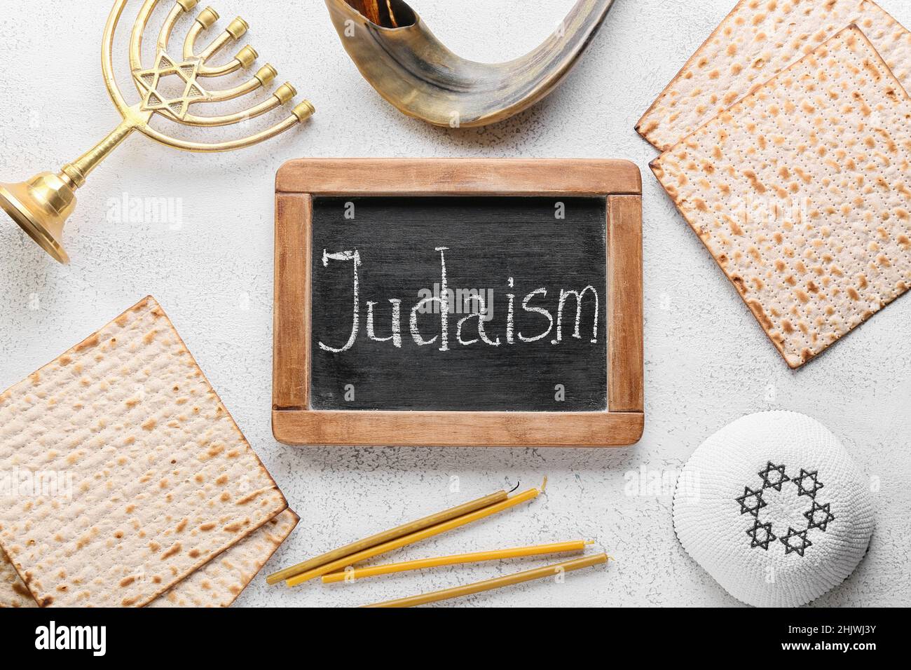 Composition with symbols of Judaism on light background Stock Photo - Alamy