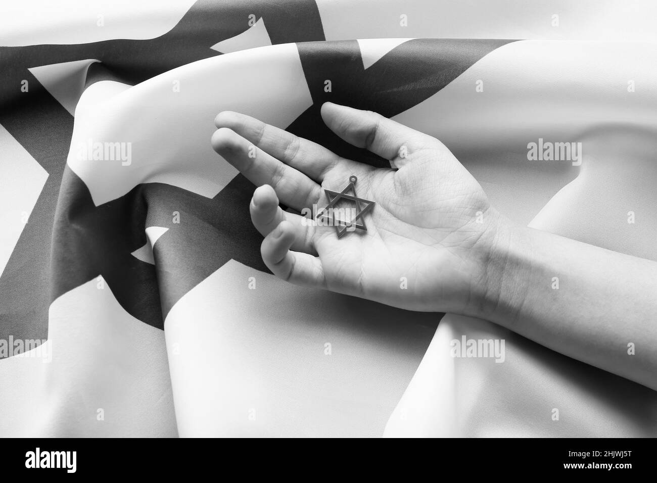 Hand with star of David on flag of Israel Stock Photo - Alamy