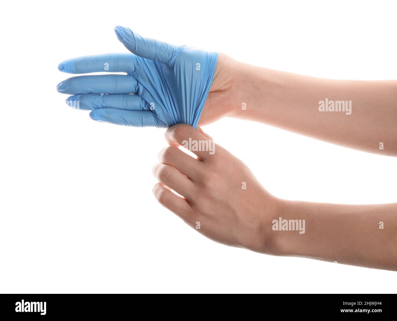 Woman taking off medical glove on white background Stock Photo - Alamy