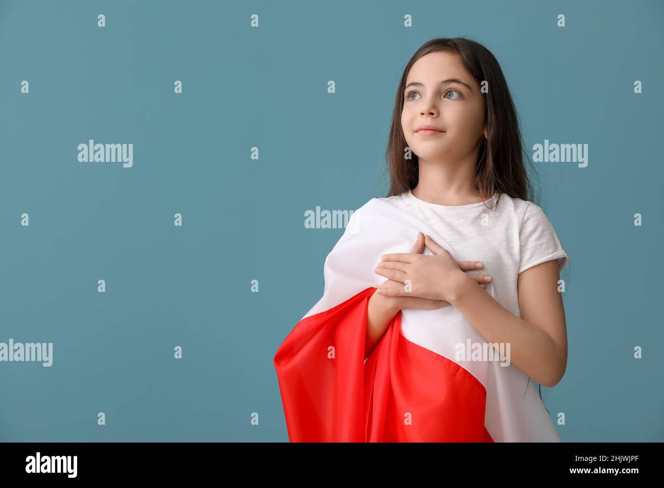Cute little girl with flag of Poland on color background Stock Photo ...