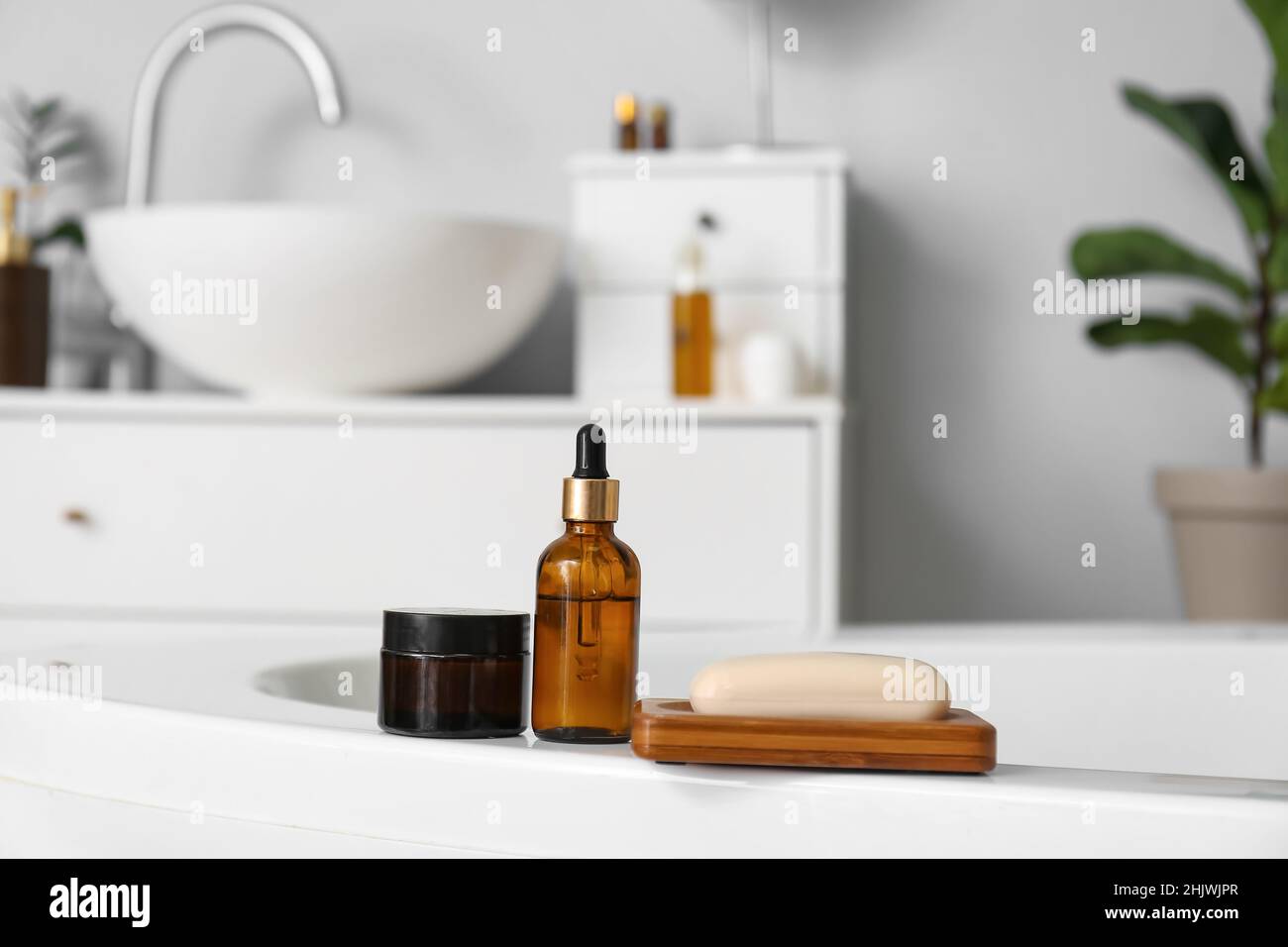 Soap and cosmetic products on bathtub Stock Photo - Alamy