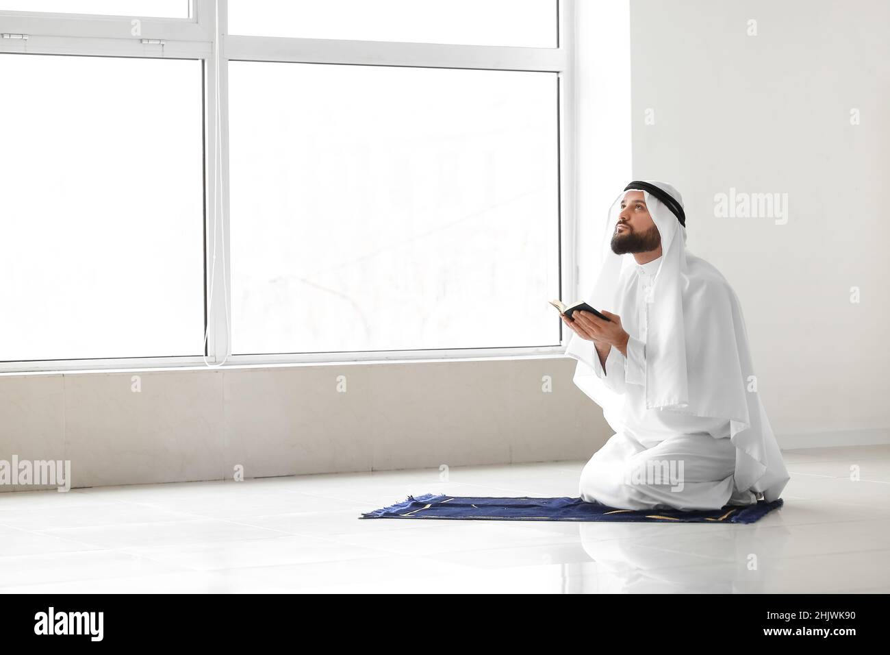 Muslim man praying at home Stock Photo - Alamy