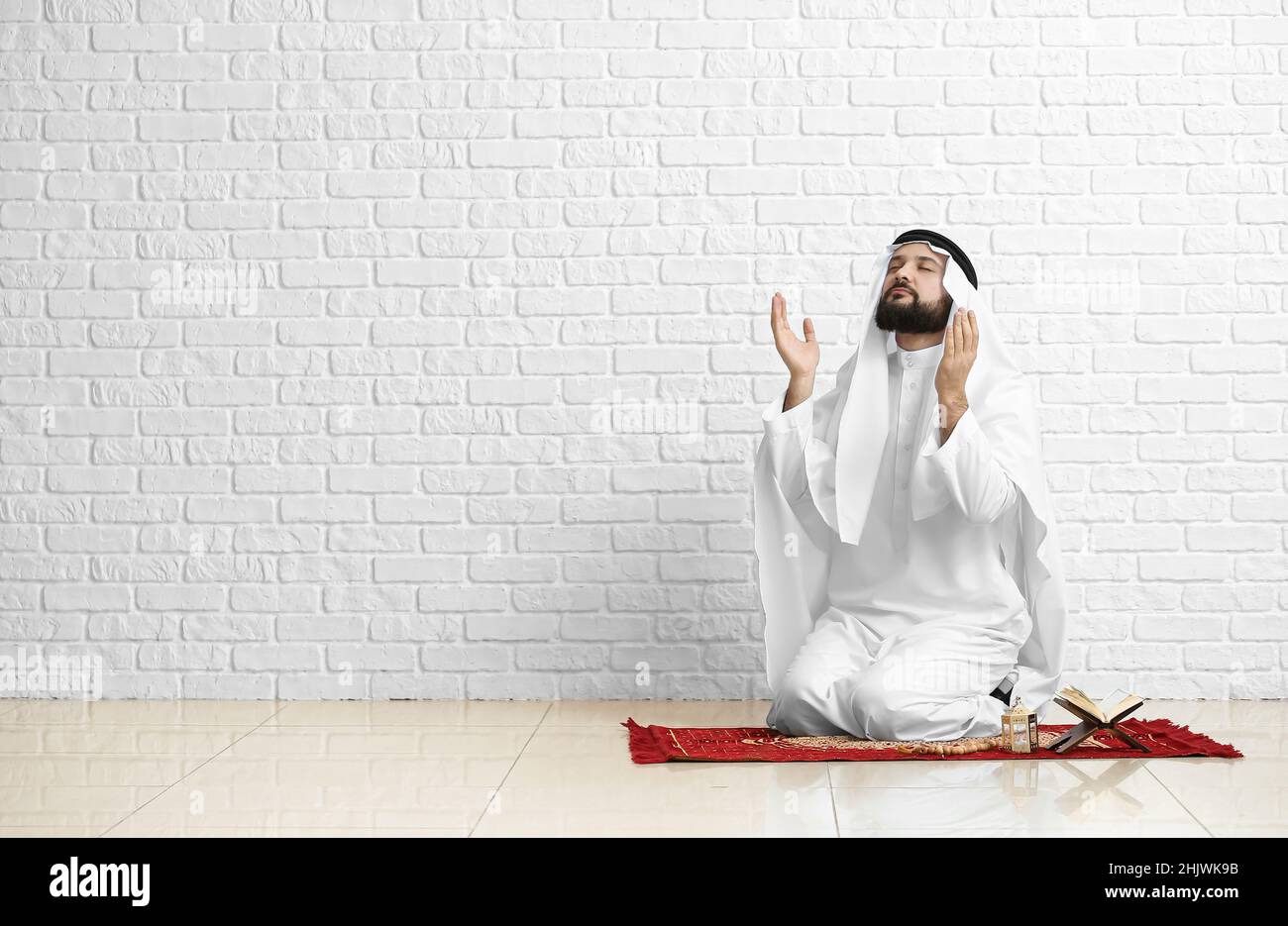 Muslim man praying at home Stock Photo - Alamy