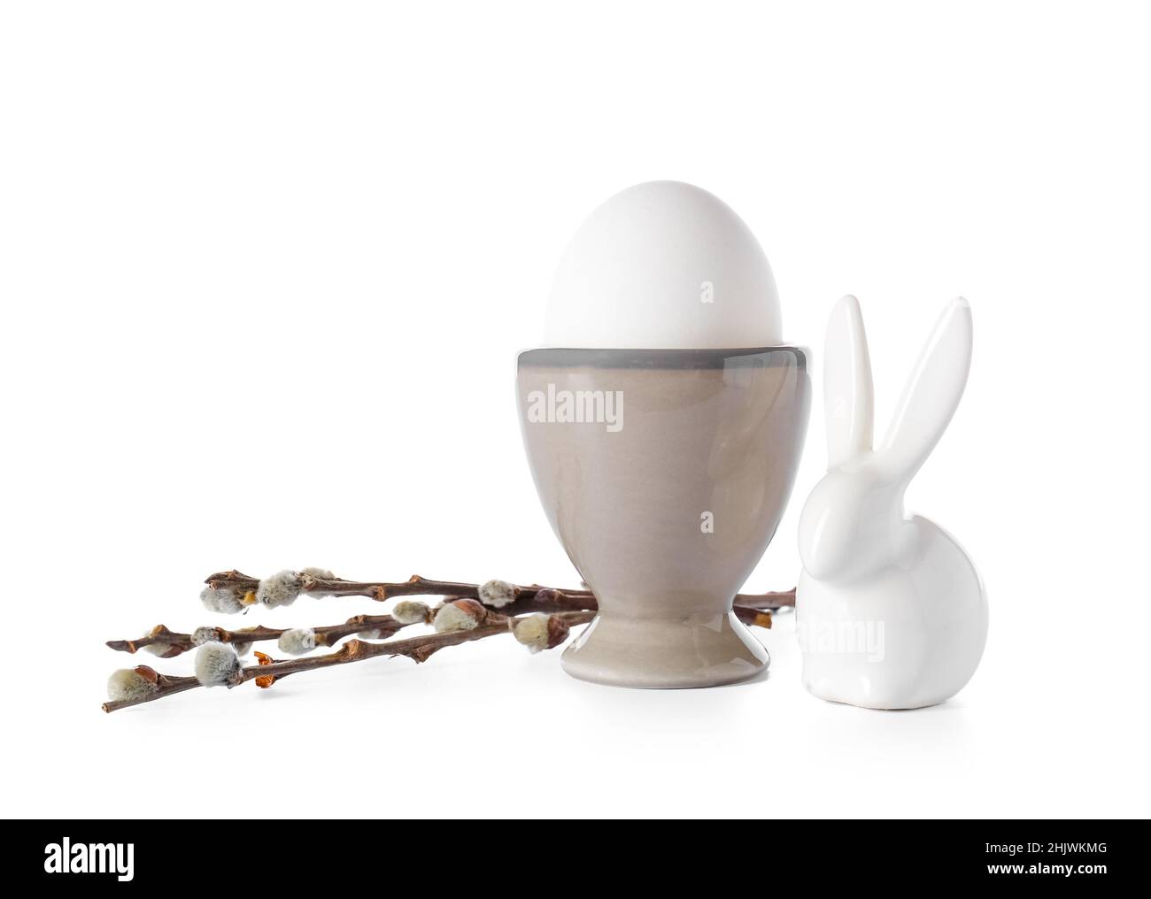 Beautiful Easter egg, willow branches and bunny on white background ...
