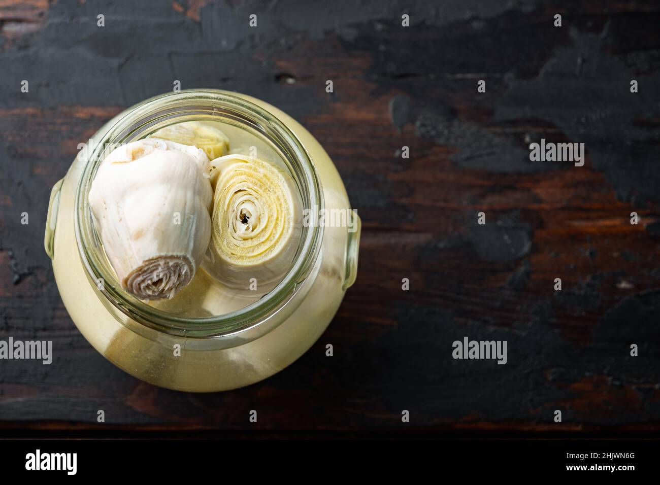 Artichoke hearts set, on old wooden table, flat lay with space for text ...