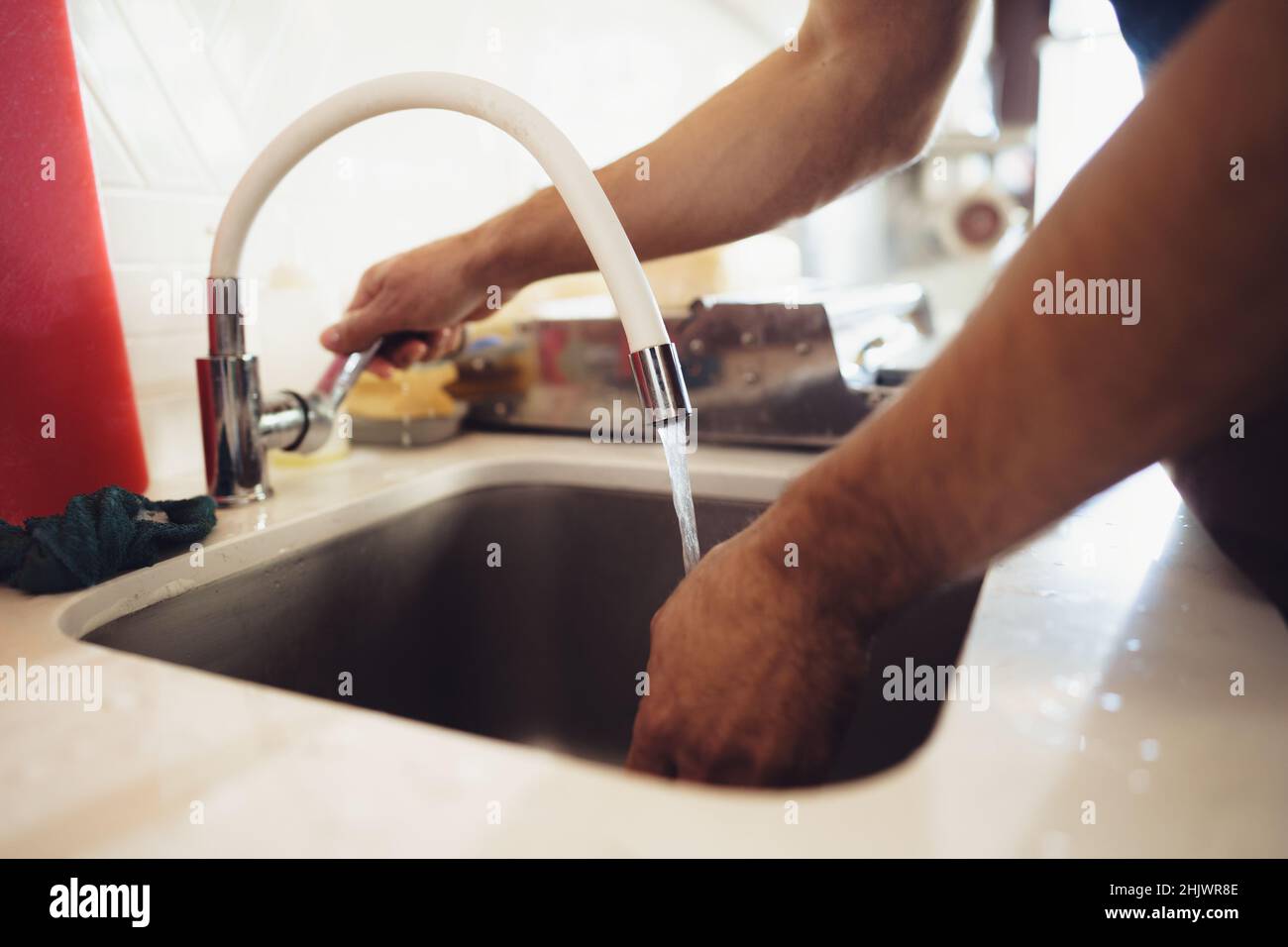 Chef washing his hands in a restaurant kitchen sink Stock Photo - Alamy