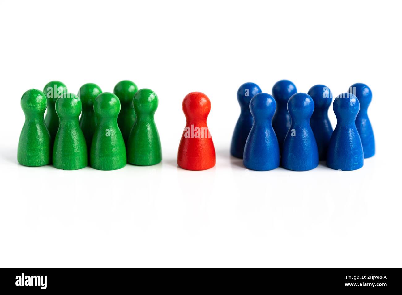 A red game piece in the middle, between two groups of other game pieces ...