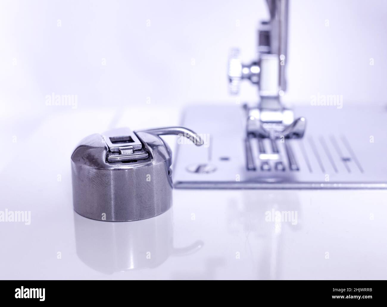 The working part of the sewing machine. the focus is on the metal ...