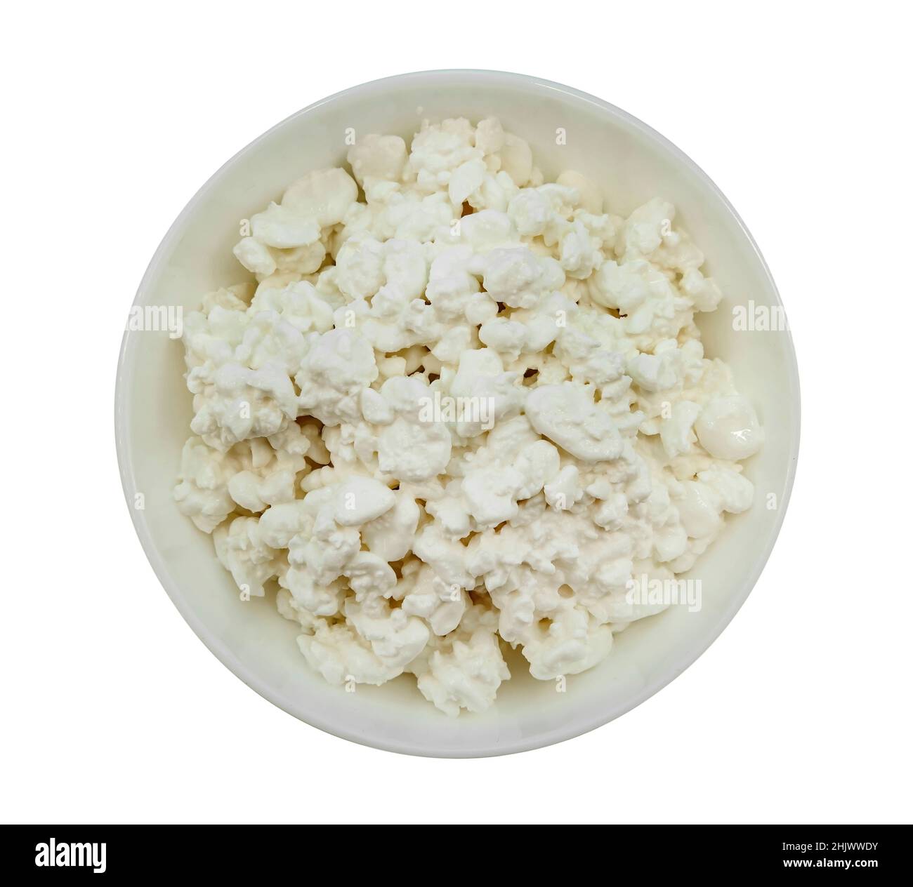 Cottage cheese grain in a white bowl. Curd mass in a plate on a white ...