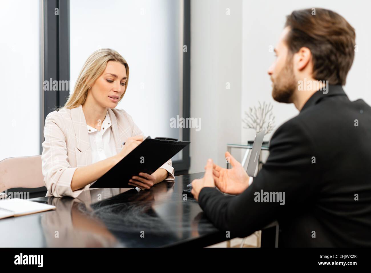 Effective work in team. Concentrated managers are discussing something ...