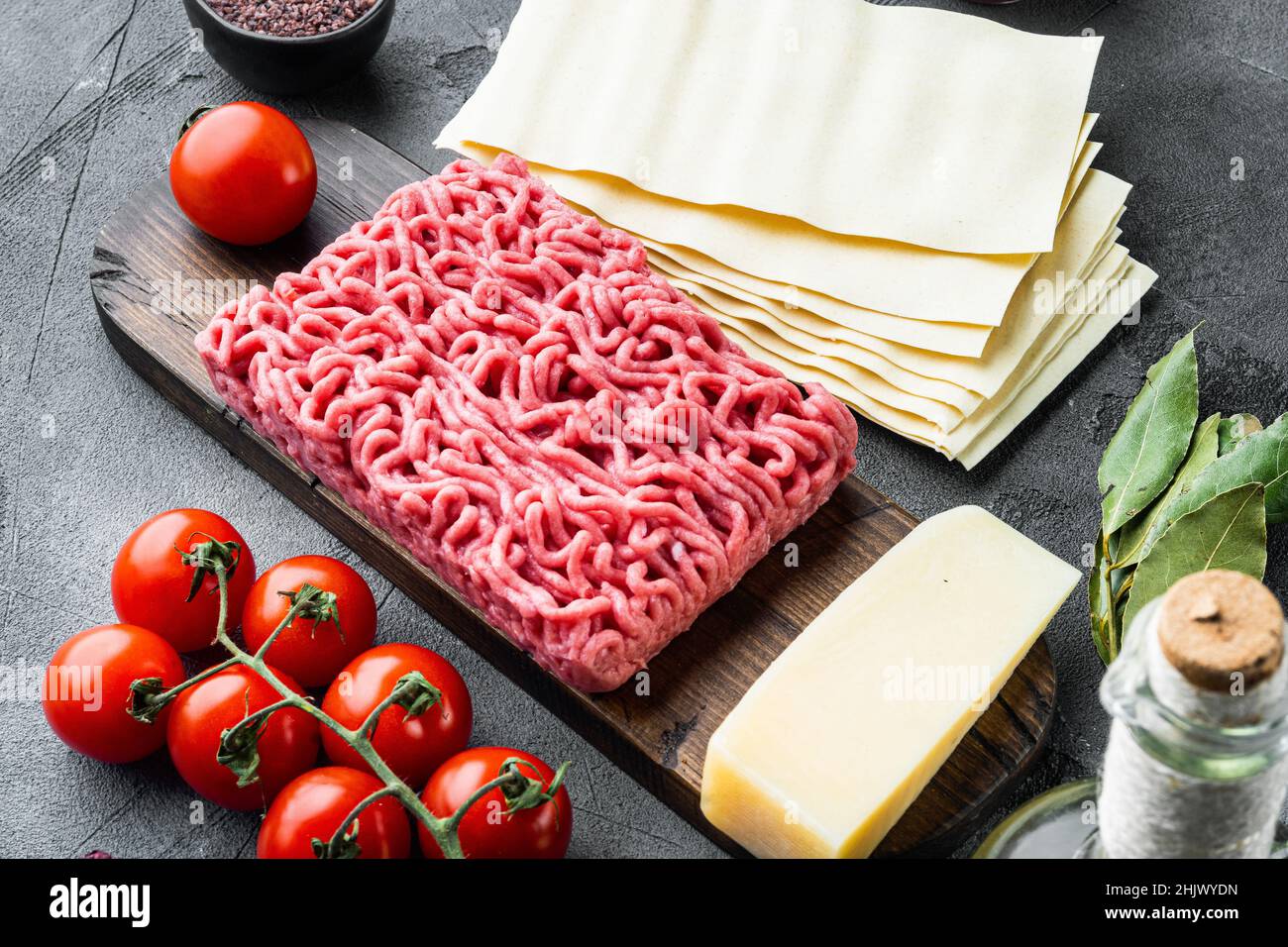 Raw lasagna ingredients and pasta set, on gray stone background Stock ...