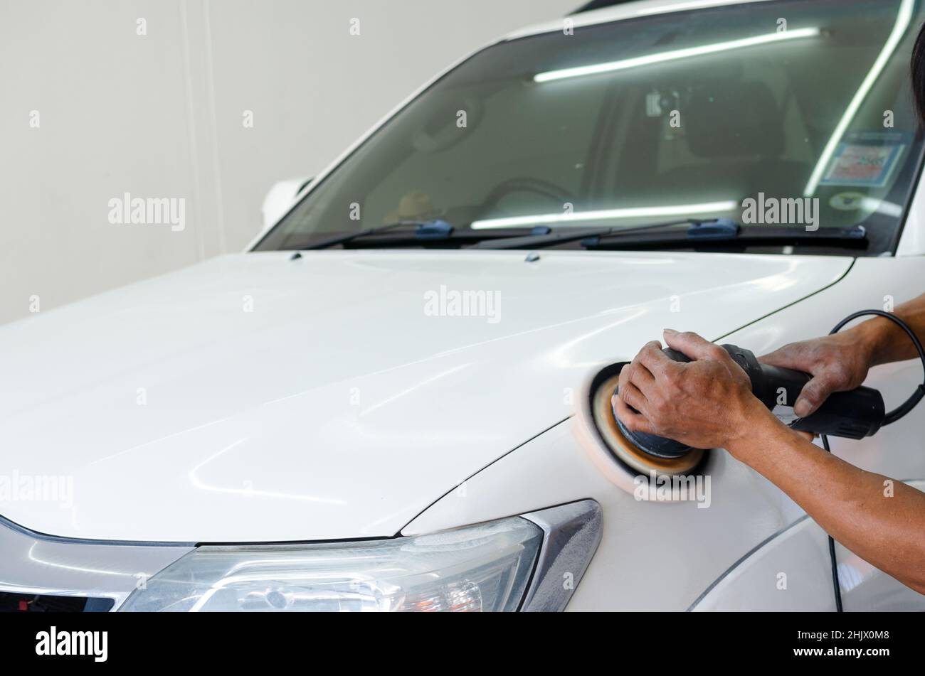 Man hands holding the work tool polish the car.Buffing and polishing ...