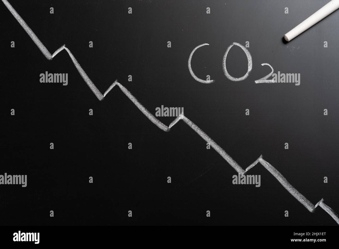decreasing lines on a blackboard showing CO2 reducing trend Stock Photo ...
