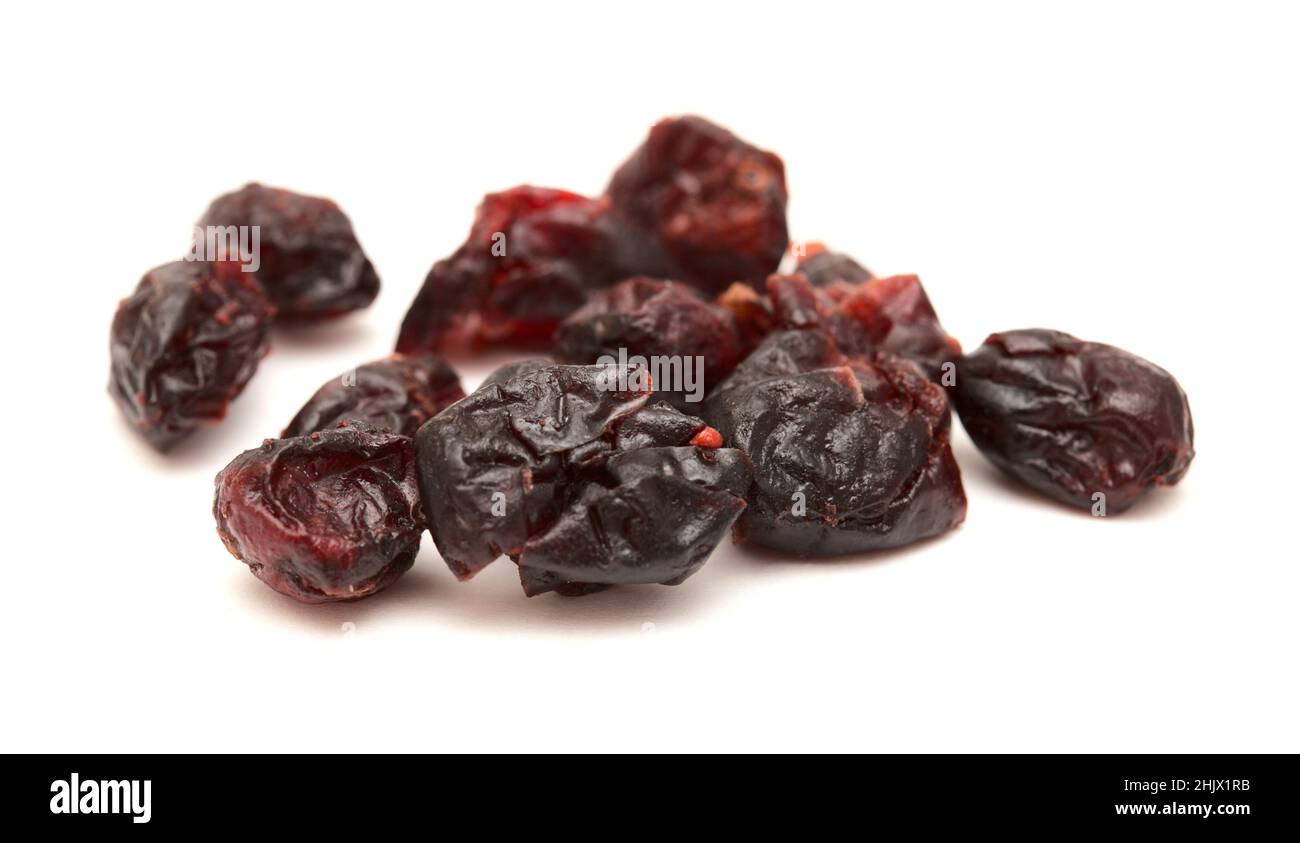 dark red dried cranberries isolated on white background Stock Photo - Alamy