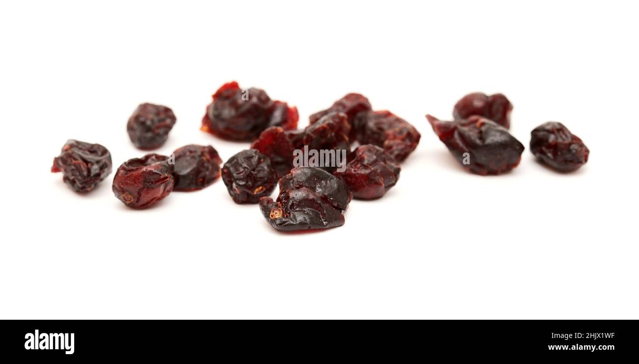 dark red dried cranberries isolated on white background Stock Photo - Alamy