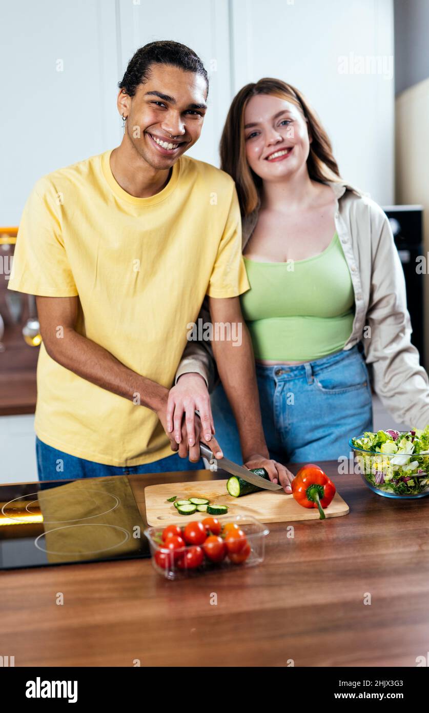 Modern multiethnic unstereotyped couple lifestyle moments at home. Not ...