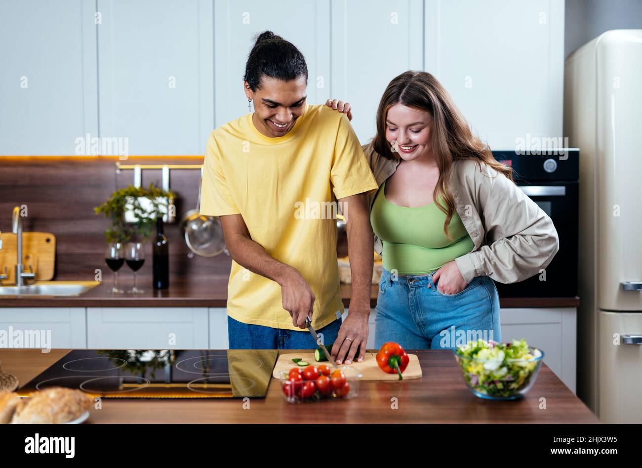 Modern multiethnic unstereotyped couple lifestyle moments at home. Not ...