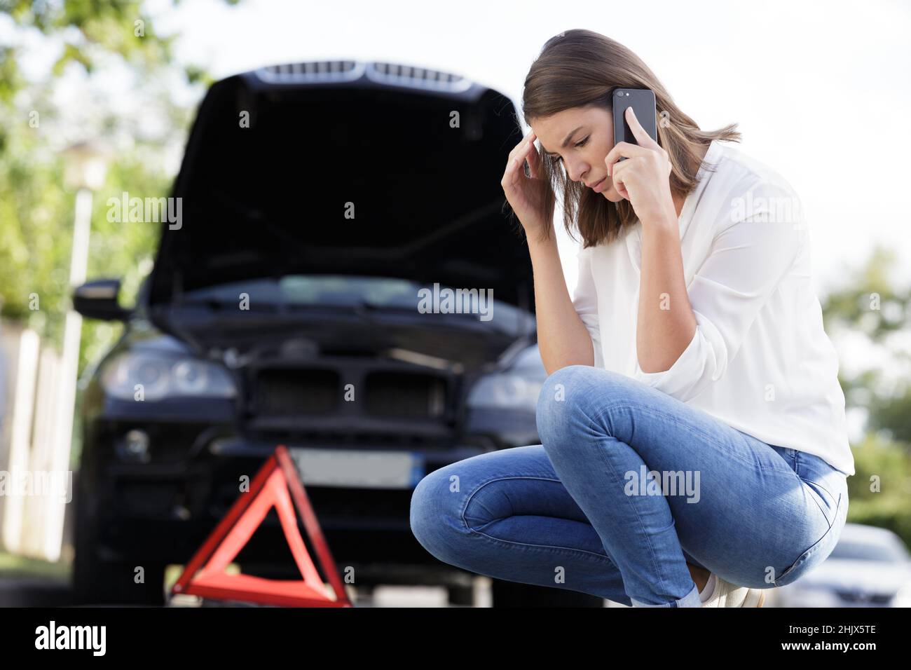 Tensed young woman using hi-res stock photography and images - Alamy