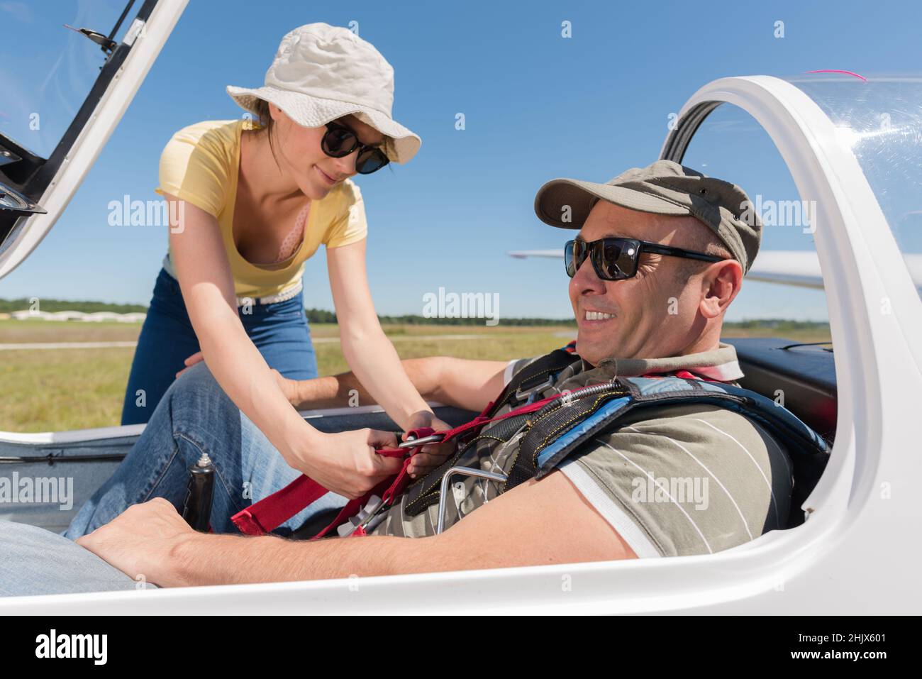beautiful couple in aircraft ready to fly Stock Photo - Alamy