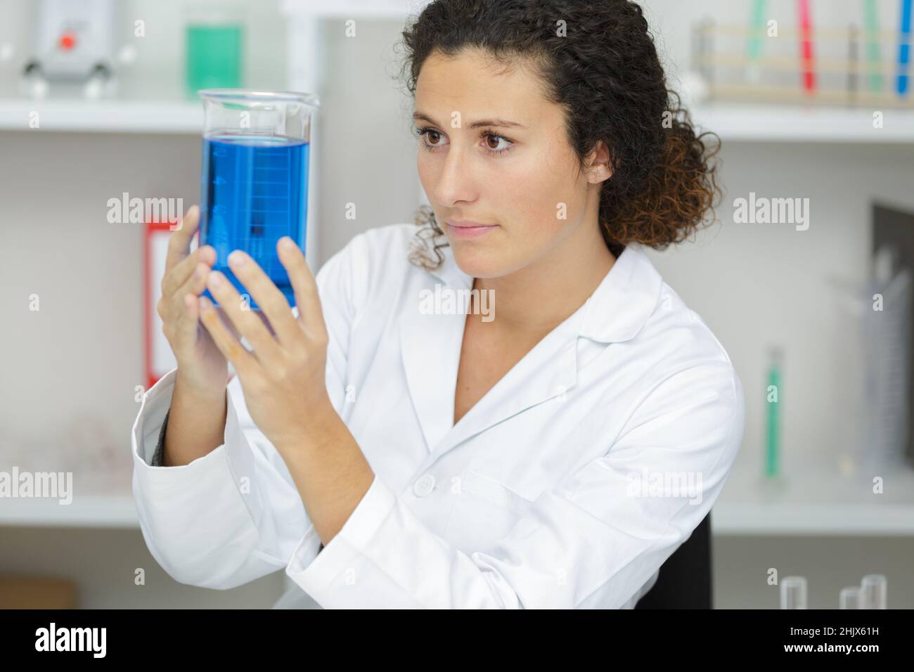 woman with flasks science lab Stock Photo - Alamy