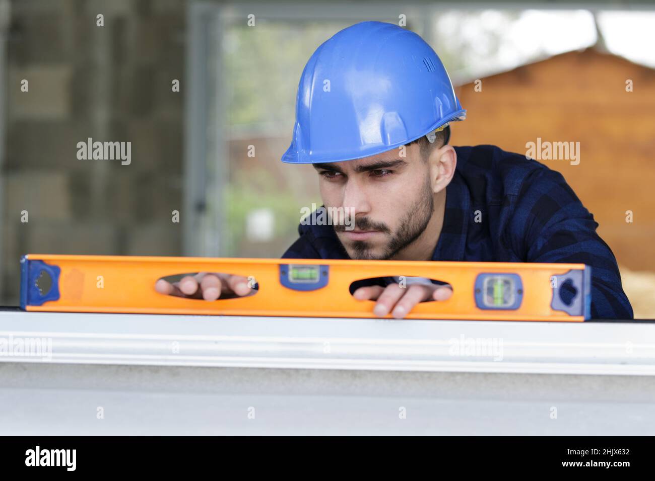 builder looks at construction level checks the horizontal surface Stock ...