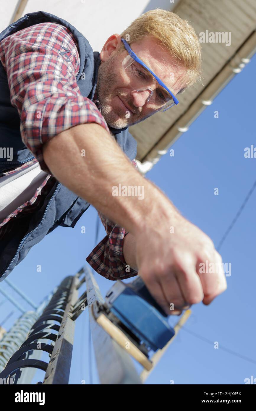 Worker using sander hi-res stock photography and images - Alamy