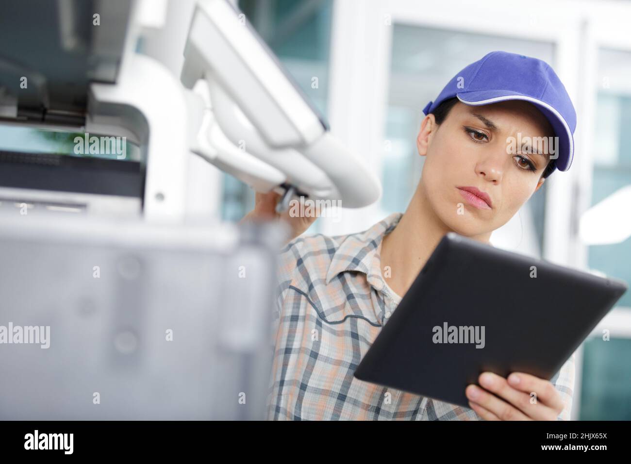 technician touch control tablet on format inkjet printer Stock Photo ...