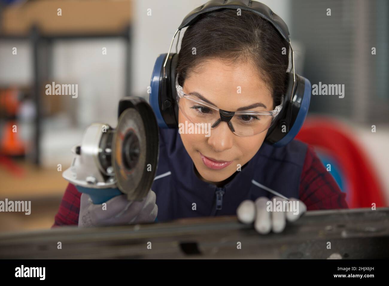 Woman worker angle grinder hi-res stock photography and images - Alamy
