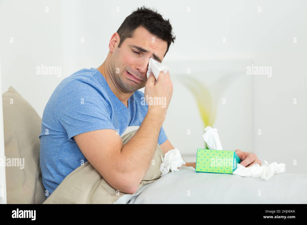 Crying man on bed hi-res stock photography and images - Alamy