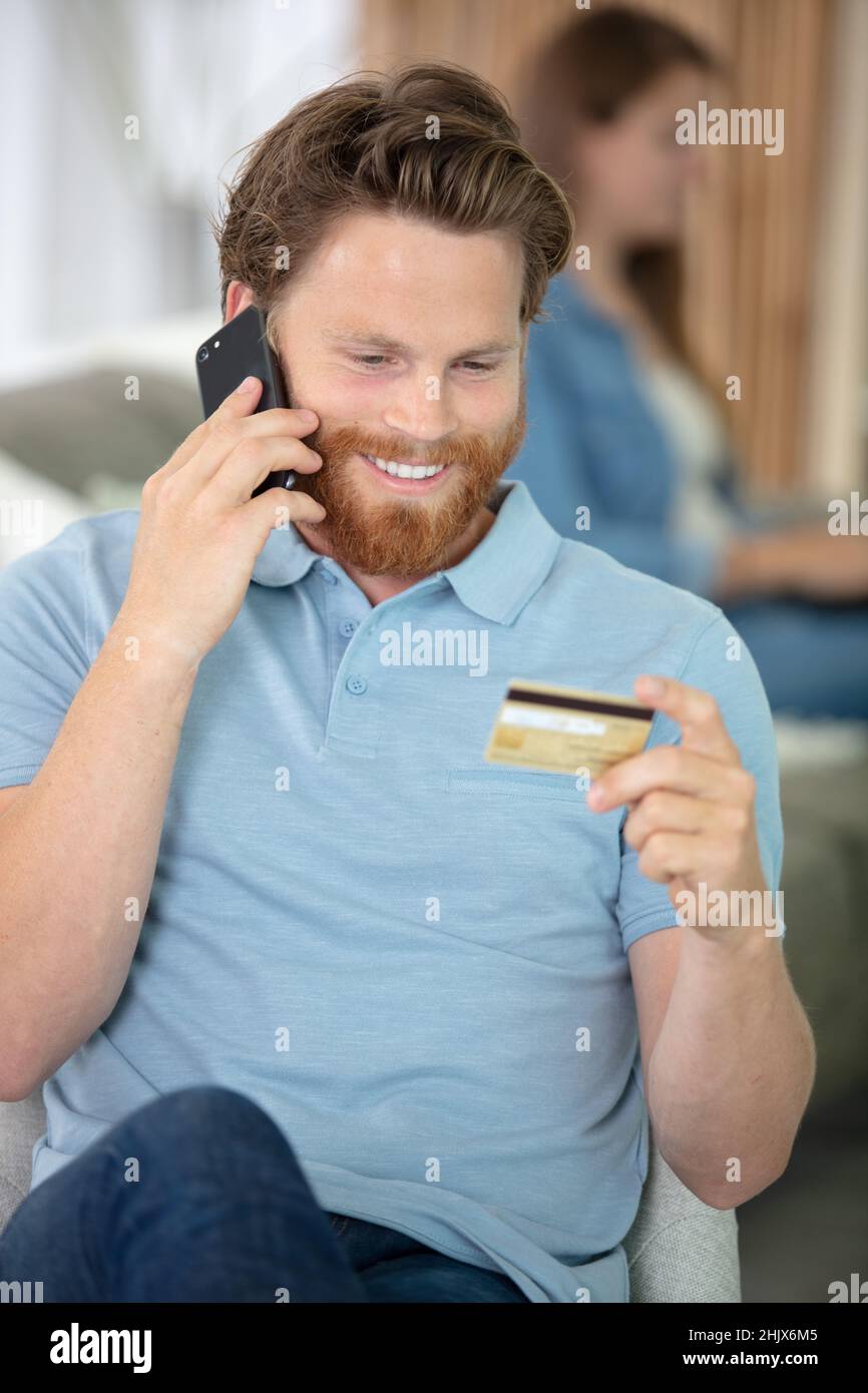 man using smart phone to pay with credit card Stock Photo - Alamy