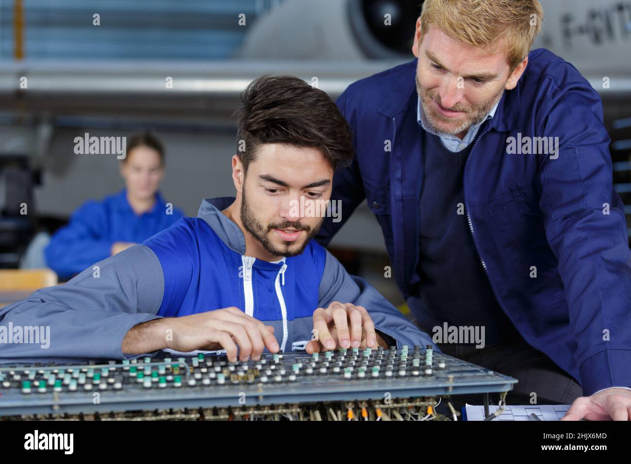 young technician working on aircraft instrument panel Stock Photo - Alamy