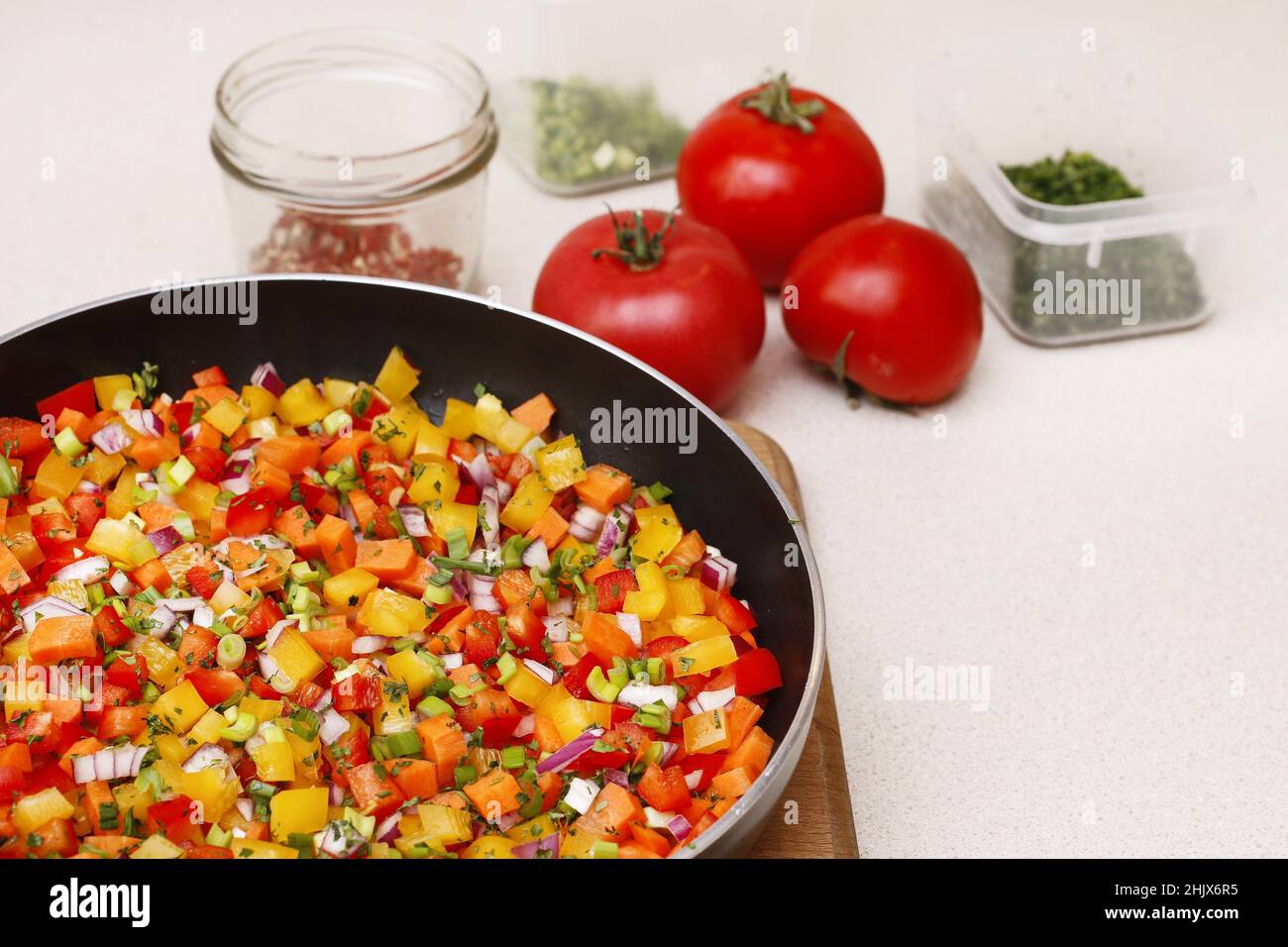 Mixed vegetables on a frying pan. Cooking time Stock Photo - Alamy
