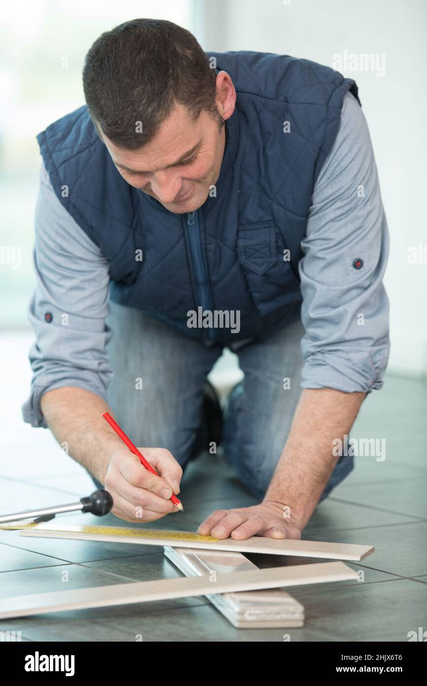 construction man uses a measuring tape Stock Photo - Alamy