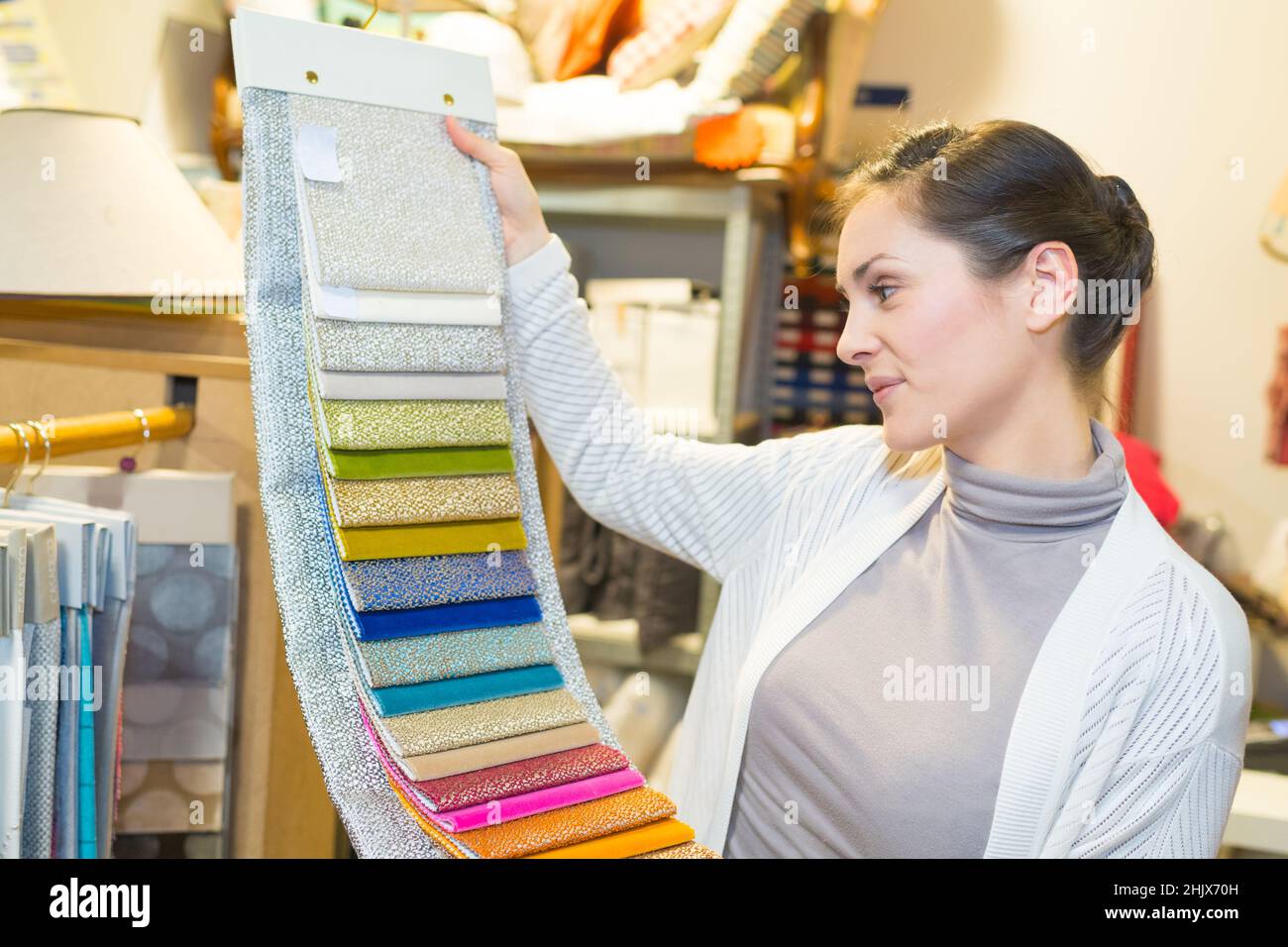 woman chooses samples of colored tissue Stock Photo - Alamy