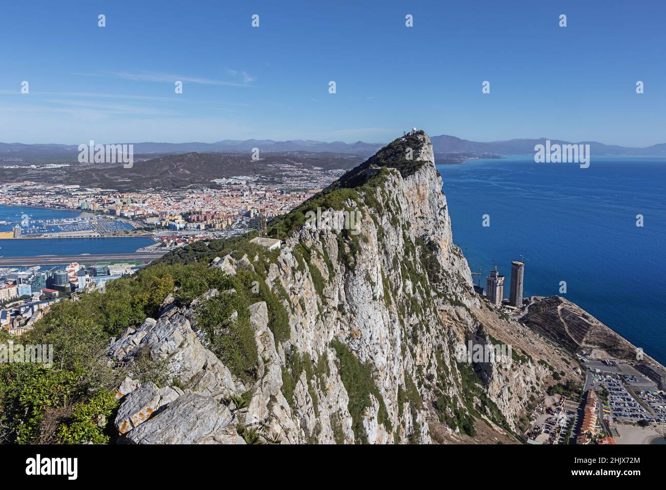 The summit of the rock of Gibraltar with La Linea de la Concepcion in ...