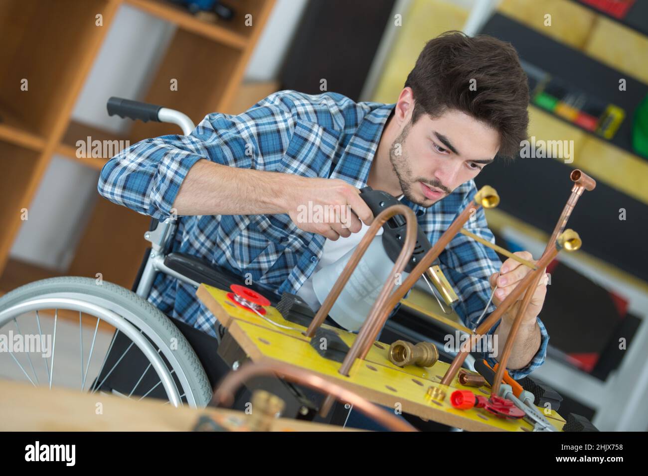 male handicapped conductor assembler Stock Photo - Alamy