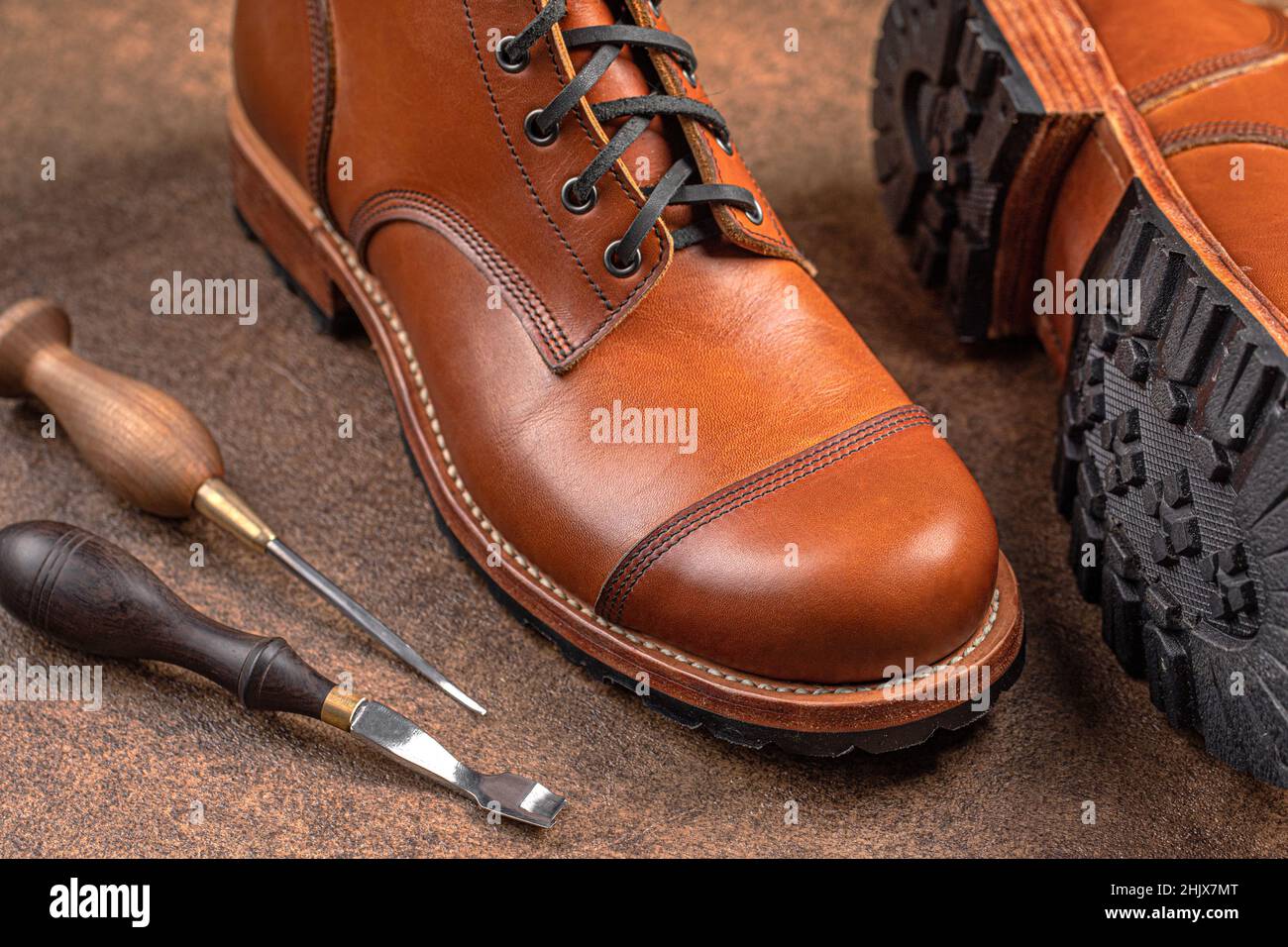 Handcrafted brown leather shoes with cobbler tools Stock Photo - Alamy