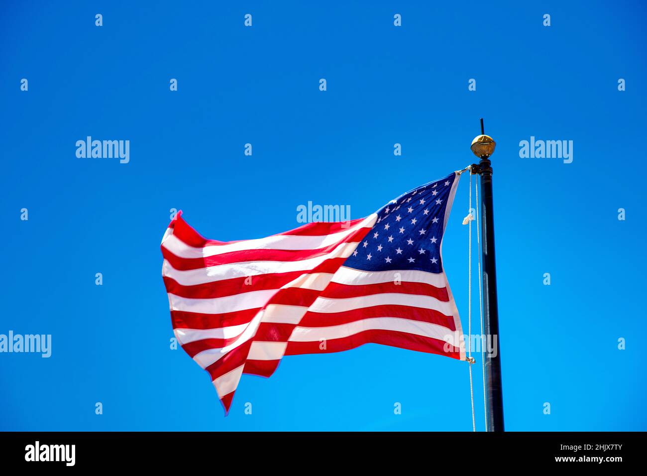 Beautiful american flag under a blue sky, USA Stock Photo - Alamy