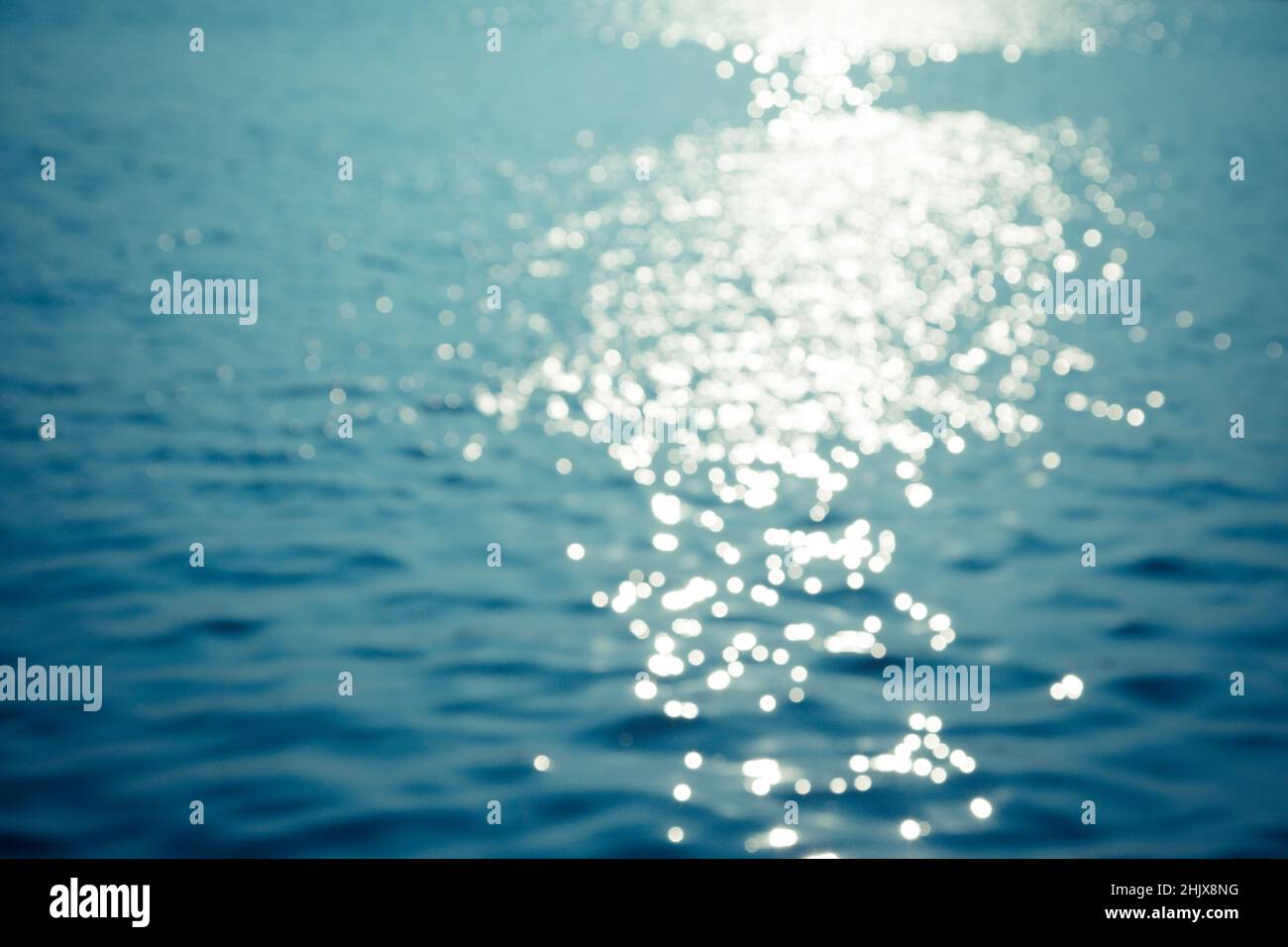 Bokeh of water reflection from sun light background Stock Photo - Alamy