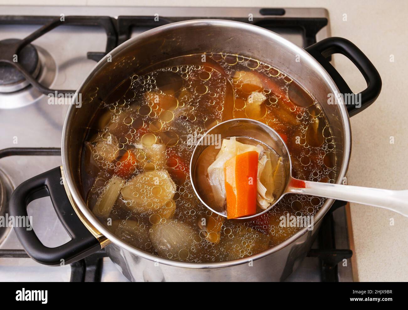 Steps of cooking chicken soup (broth) in the kitchen Stock Photo - Alamy