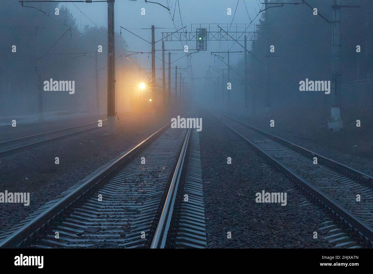 The train is traveling in bad cloudy foggy weather Stock Photo - Alamy