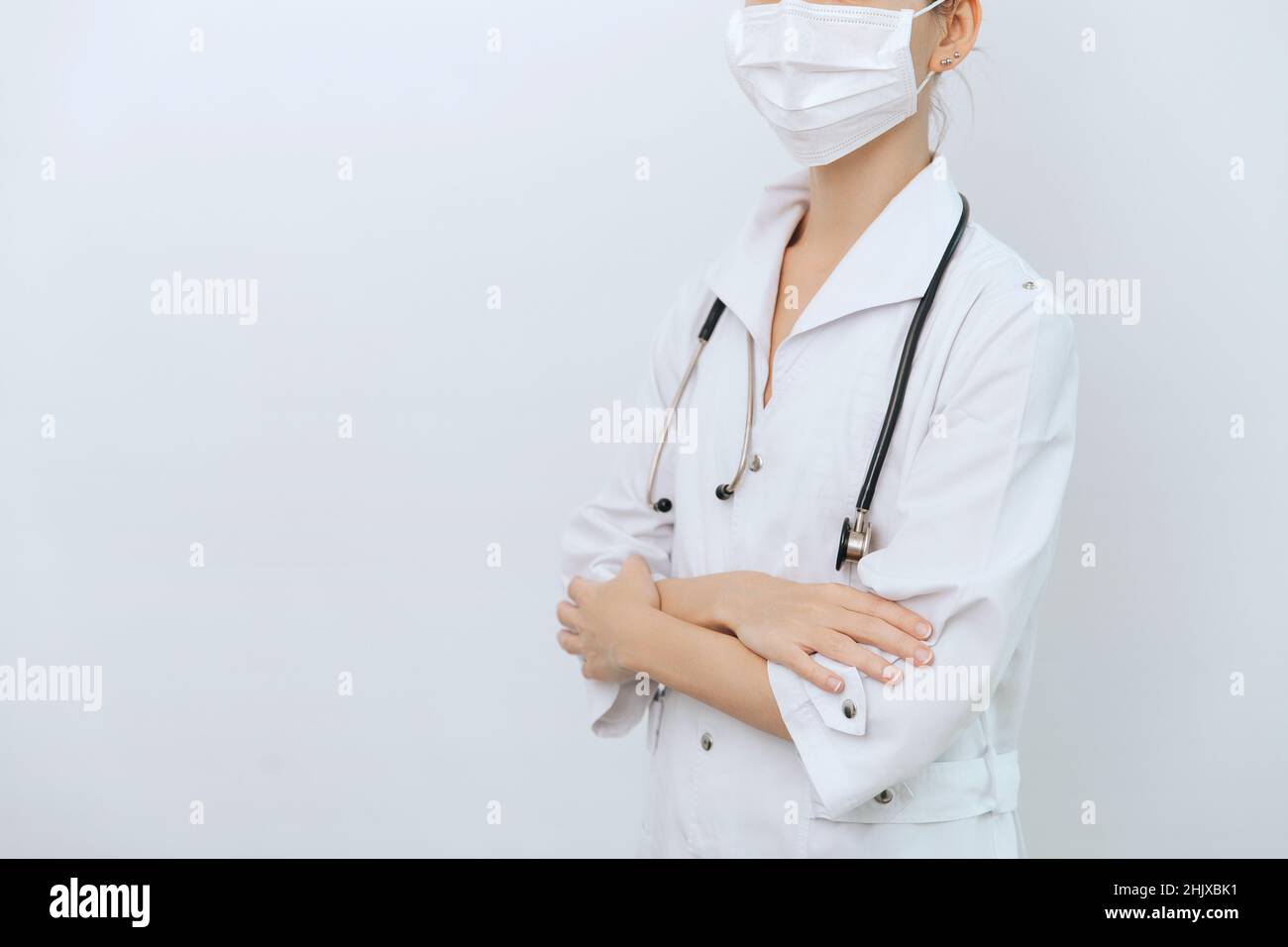 Doctor with stethoscope in medical coat on white background. Front ...
