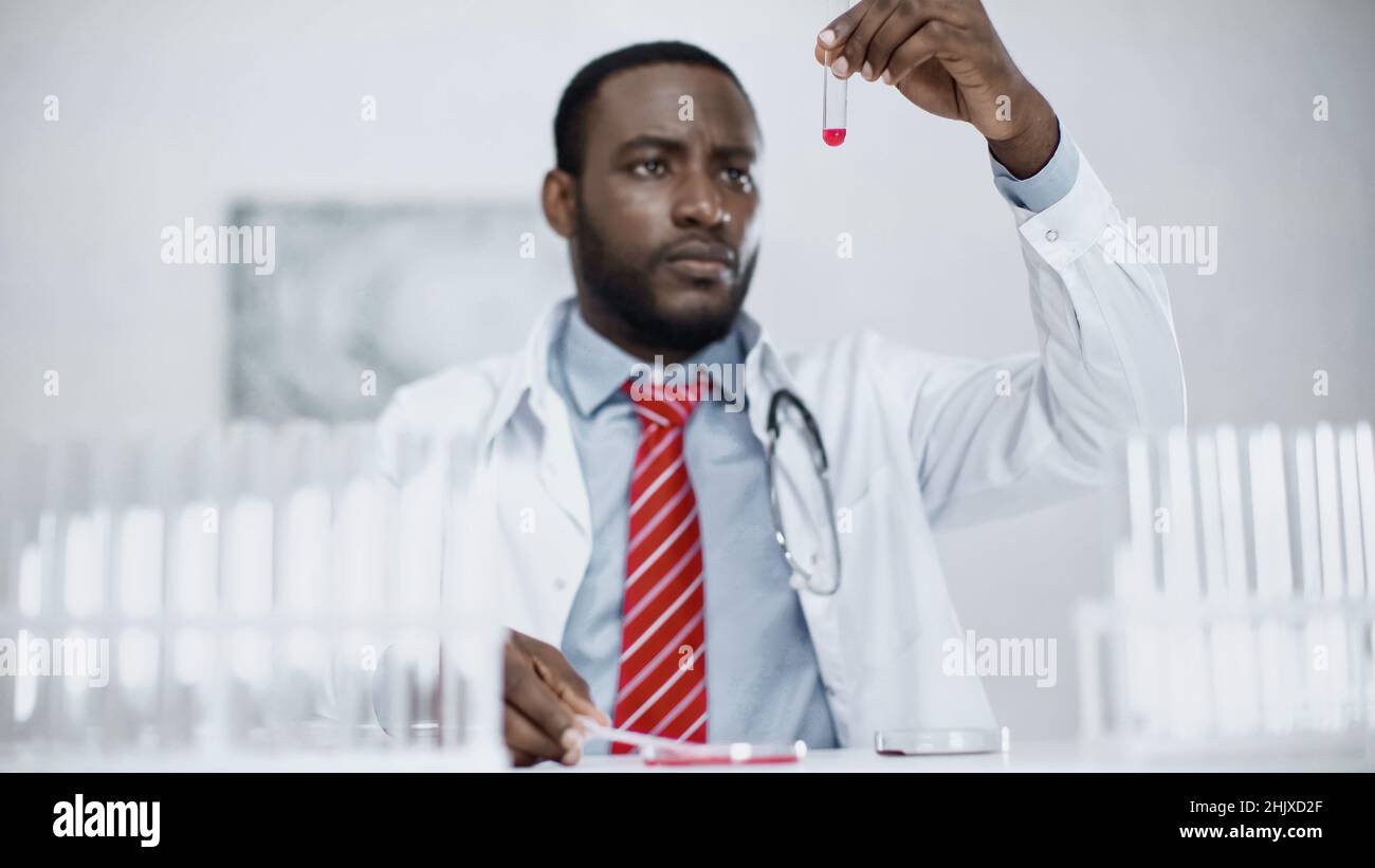 Beautiful scientist looking red liquid hi-res stock photography and ...