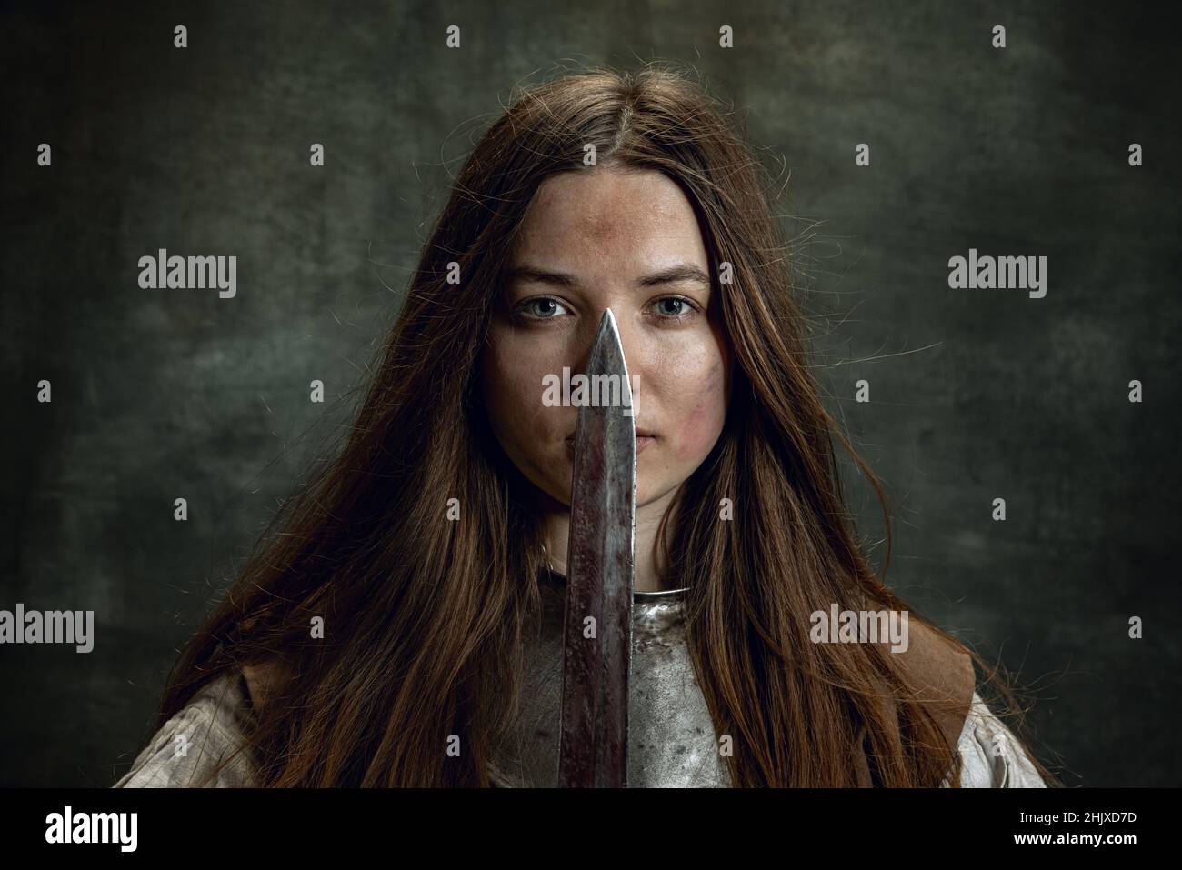 Vintage portrait of adorable woman, medieval female warrior or knight ...